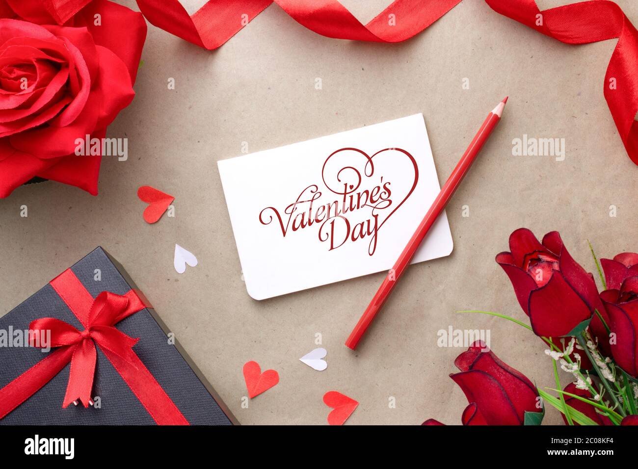 Valentine's day gifts and greetings with Red roses Stock Photo - Alamy