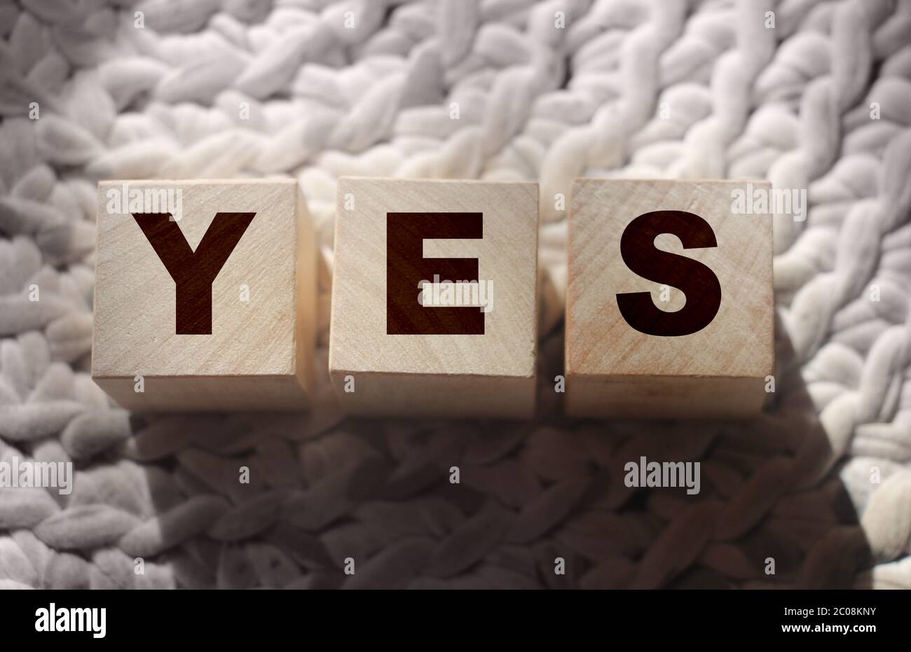 The word Yes written in black letters on wooden blocks. Business ...