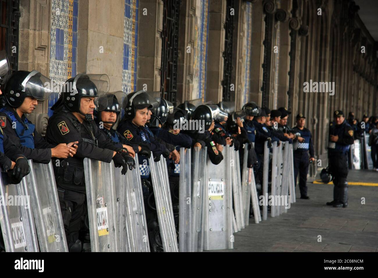 Mexican Police Officers in Riot Gear outside building in Zocalo Square ...
