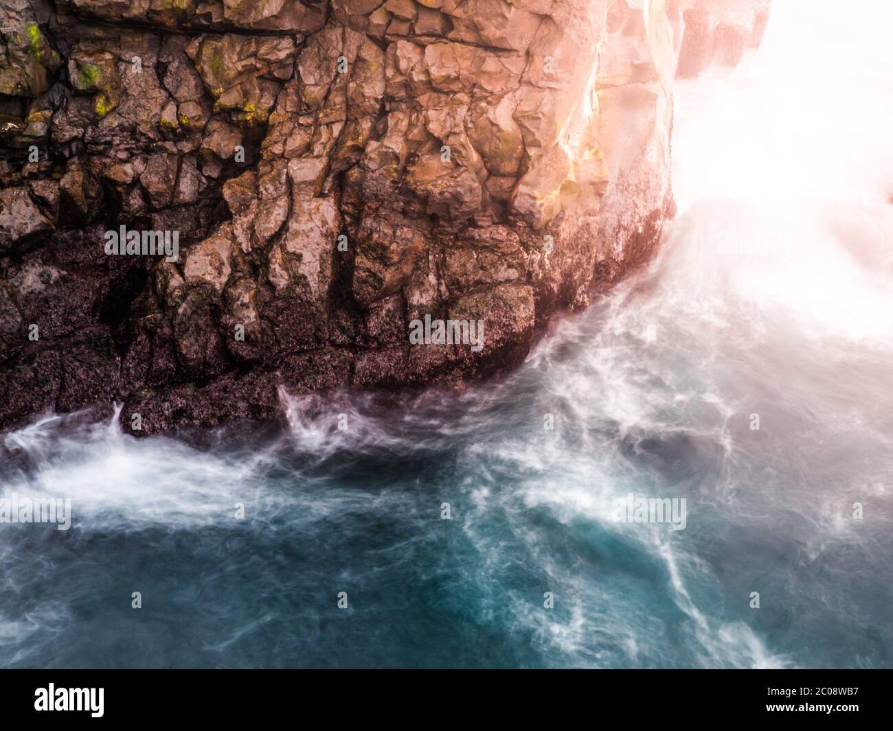 Water splash of breaking wave on the rocky shore Stock Photo - Alamy