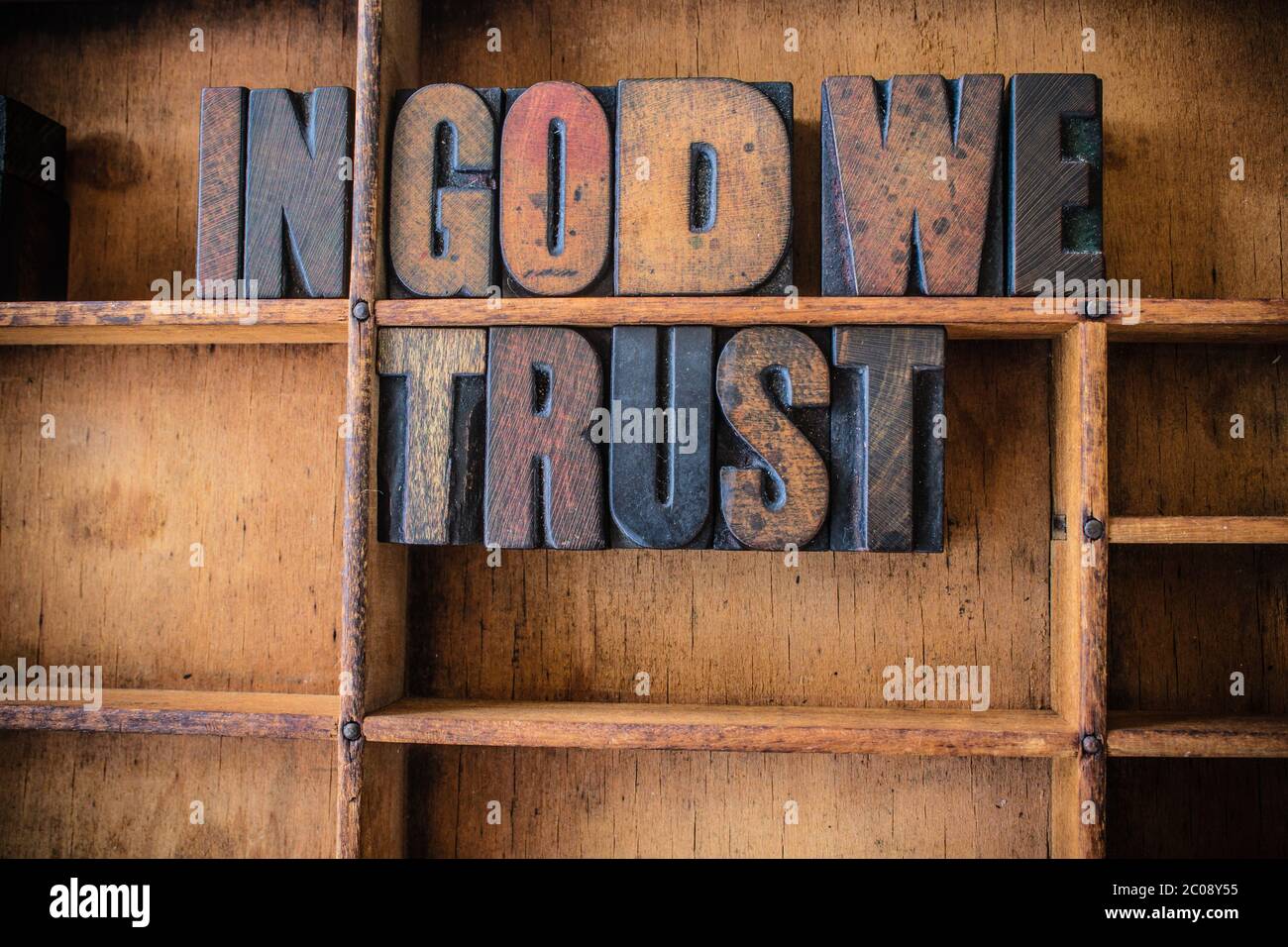 In God We Trust Concept Wooden Letterpress Theme Stock Photo - Alamy