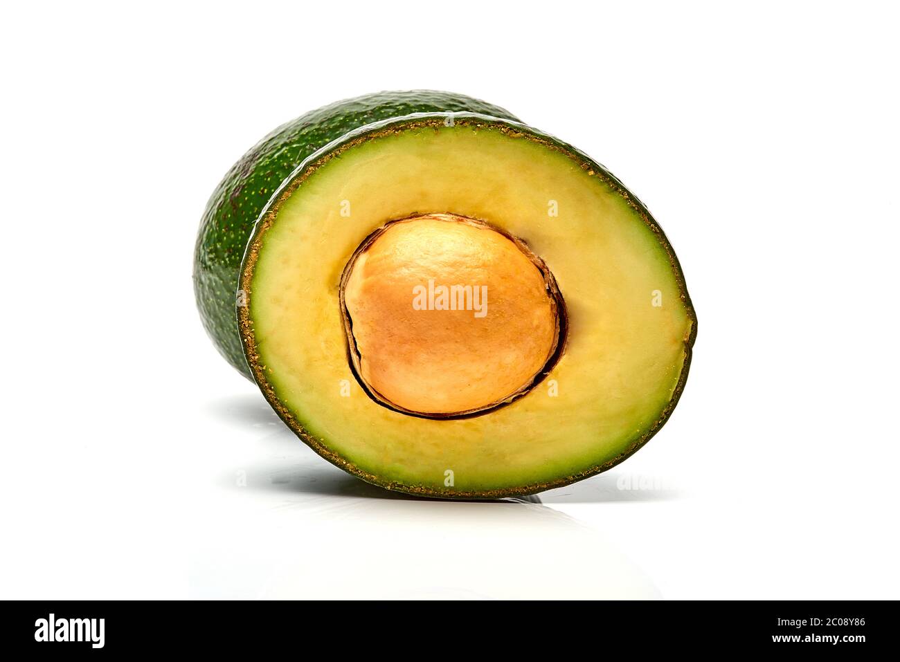 Avocado cut in half, shot on white background Stock Photo - Alamy