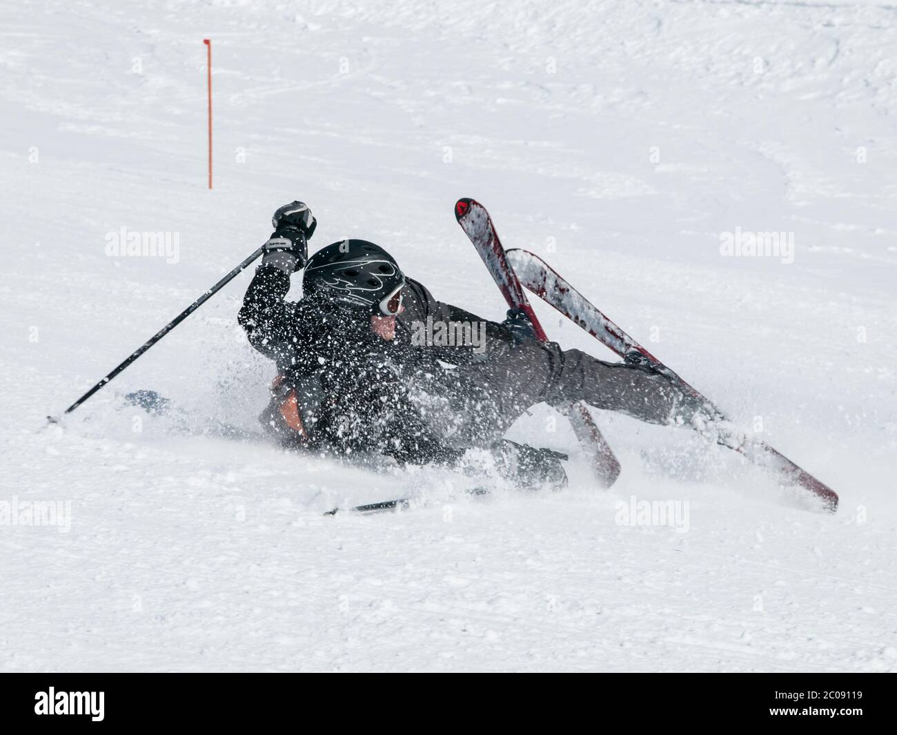 A smiling skier fall on the ski slope Stock Photo - Alamy