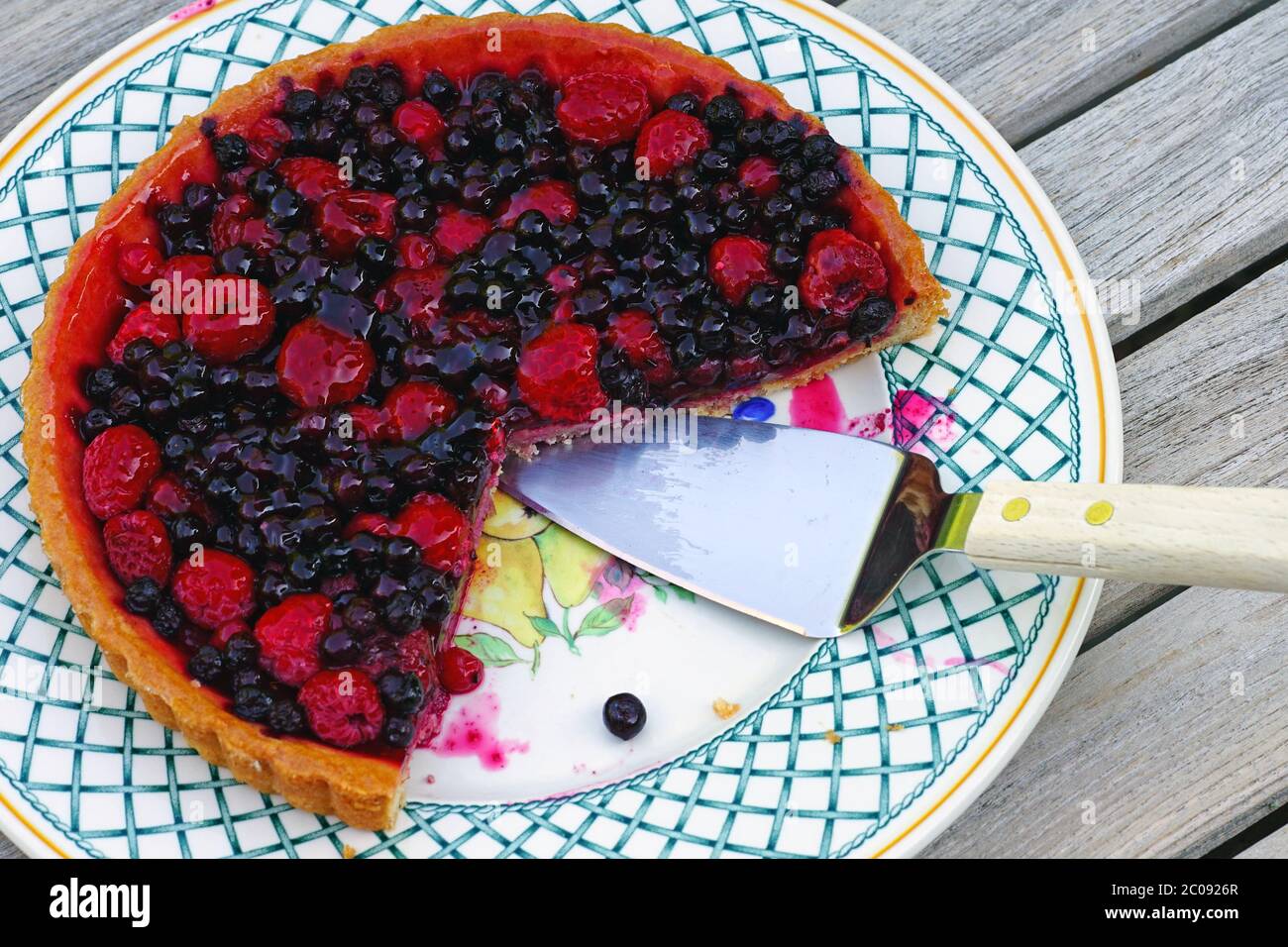 Colorful mixed berries fruit tart Stock Photo - Alamy