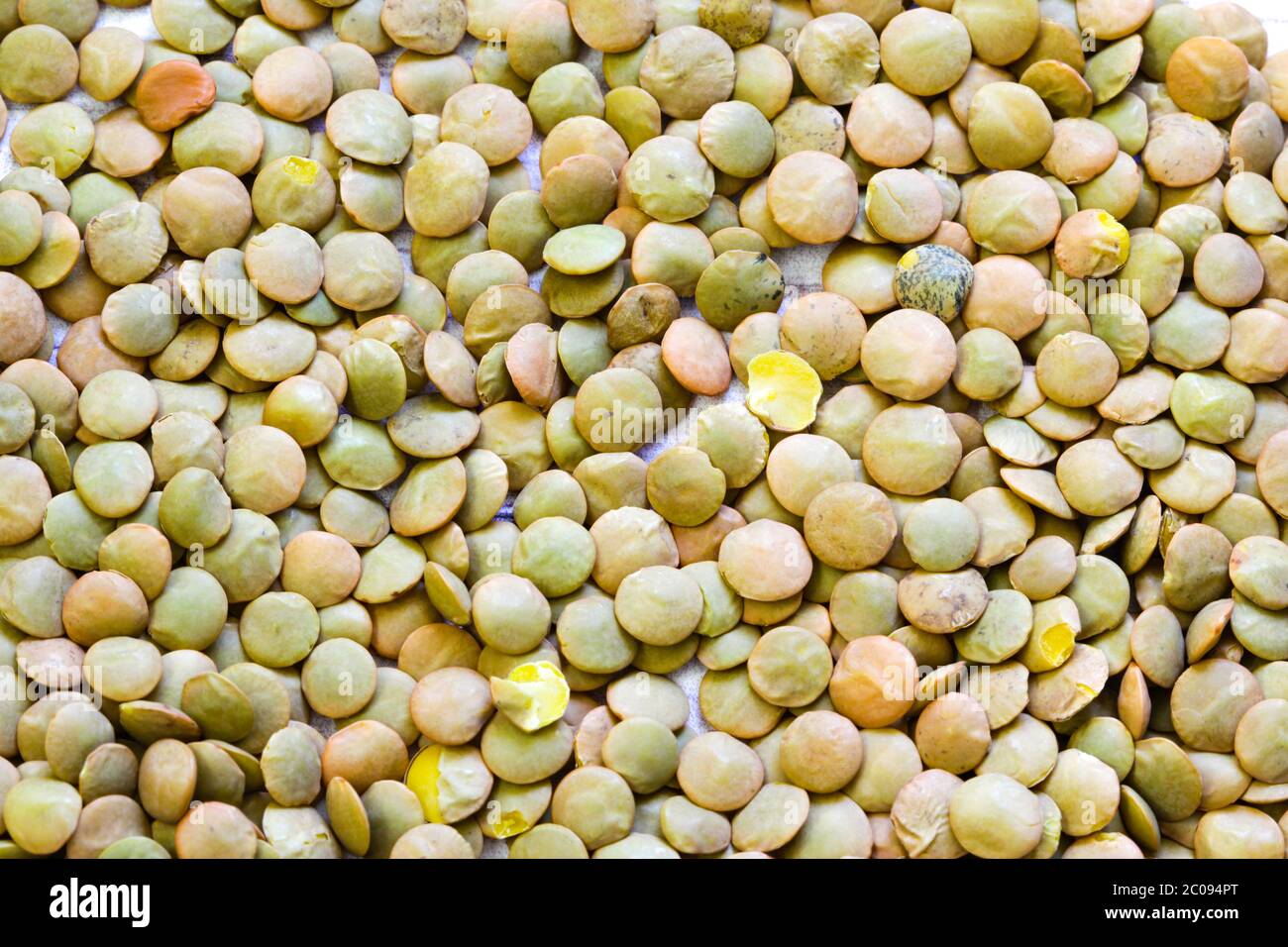 Heap of green lentil texture as background. Uncooked lentils. Top view ...