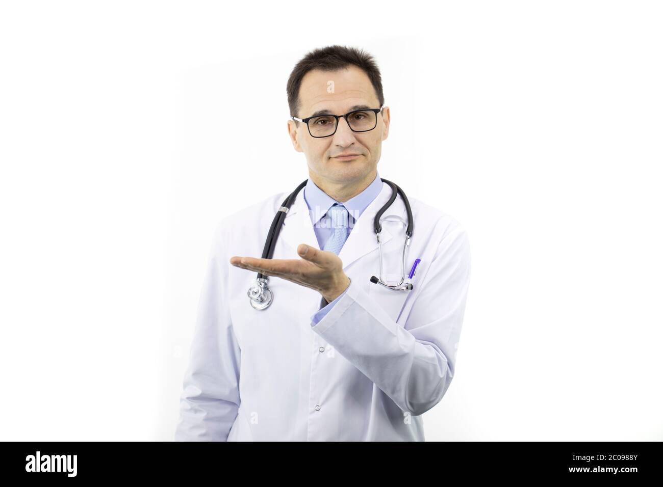 Positive doctor in medical coat and stethoscope holds empty palm with ...