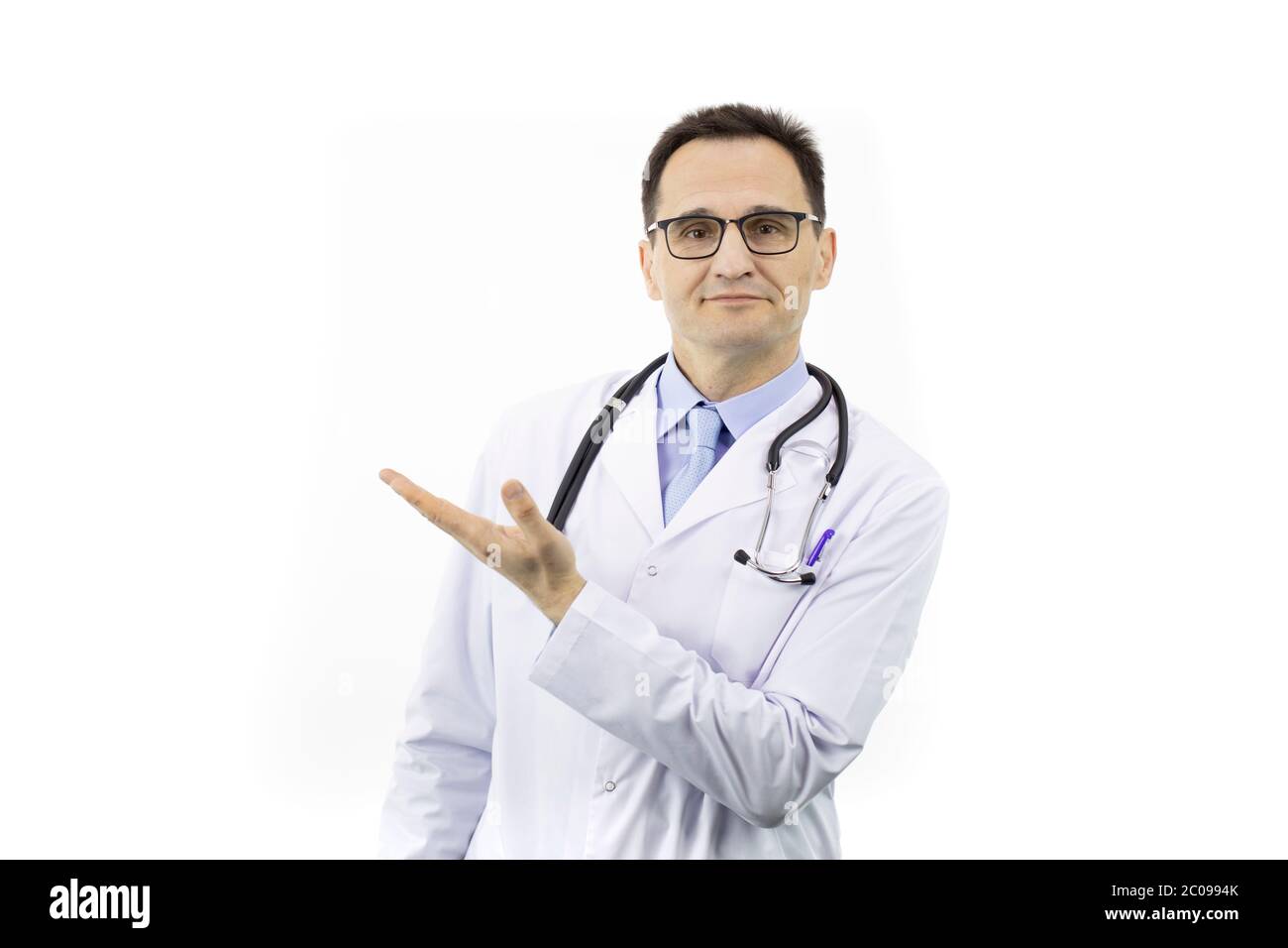 Positive doctor in medical coat and stethoscope pointing at empty text ...