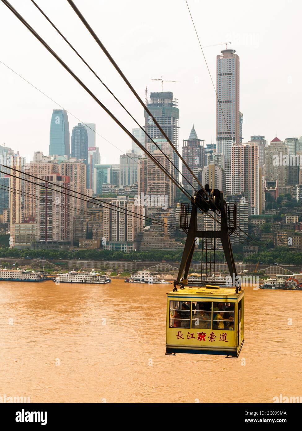 Cableway over muddy Yangtze River in Chongqing, China Stock Photo - Alamy