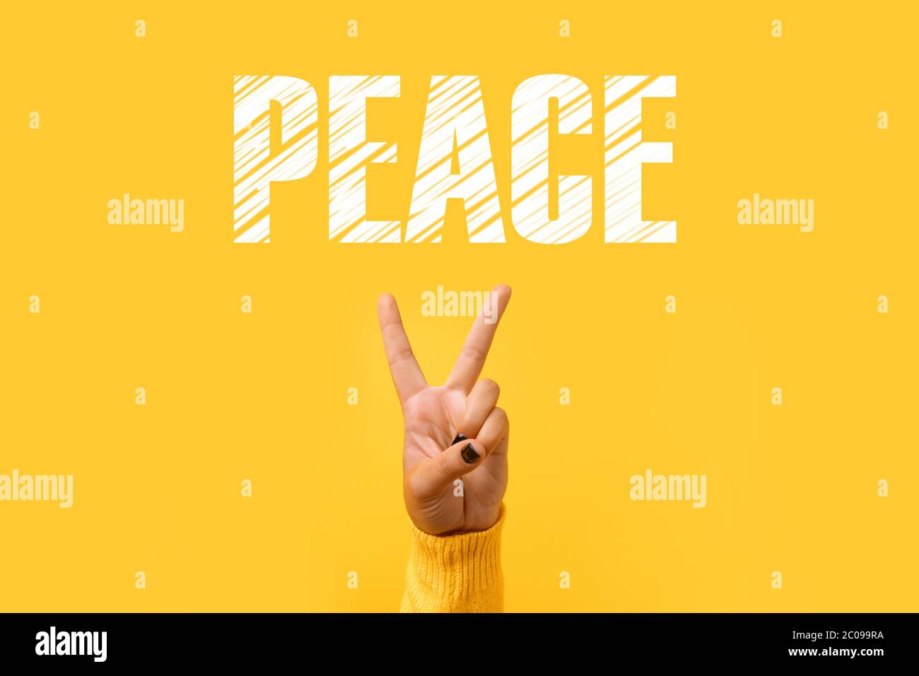 Hand gesture V sign for victory or peace sign over yellow background ...