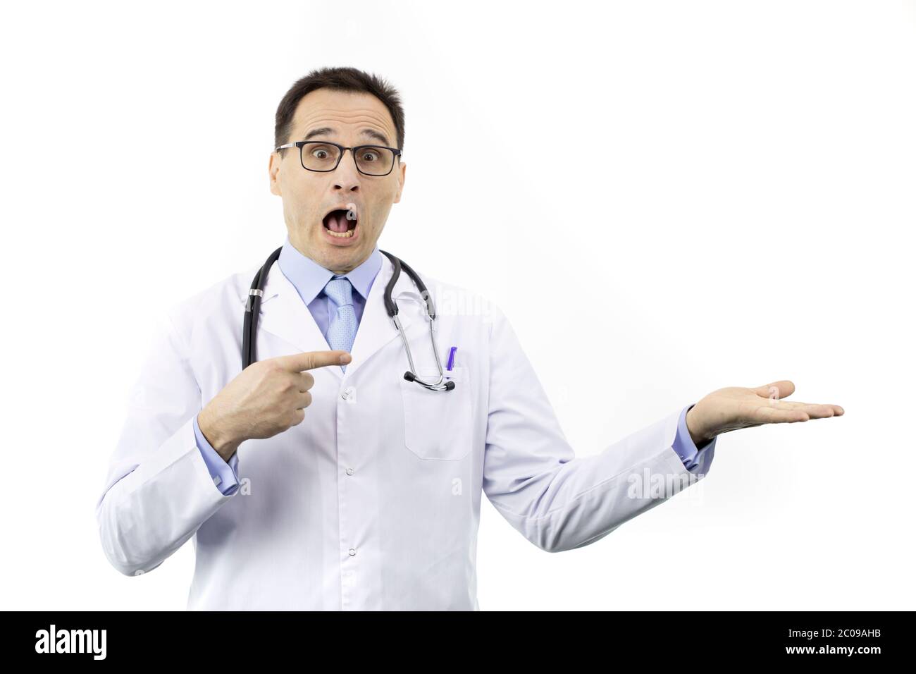 Shocked surprised doctor in medical uniform points with finger to open ...