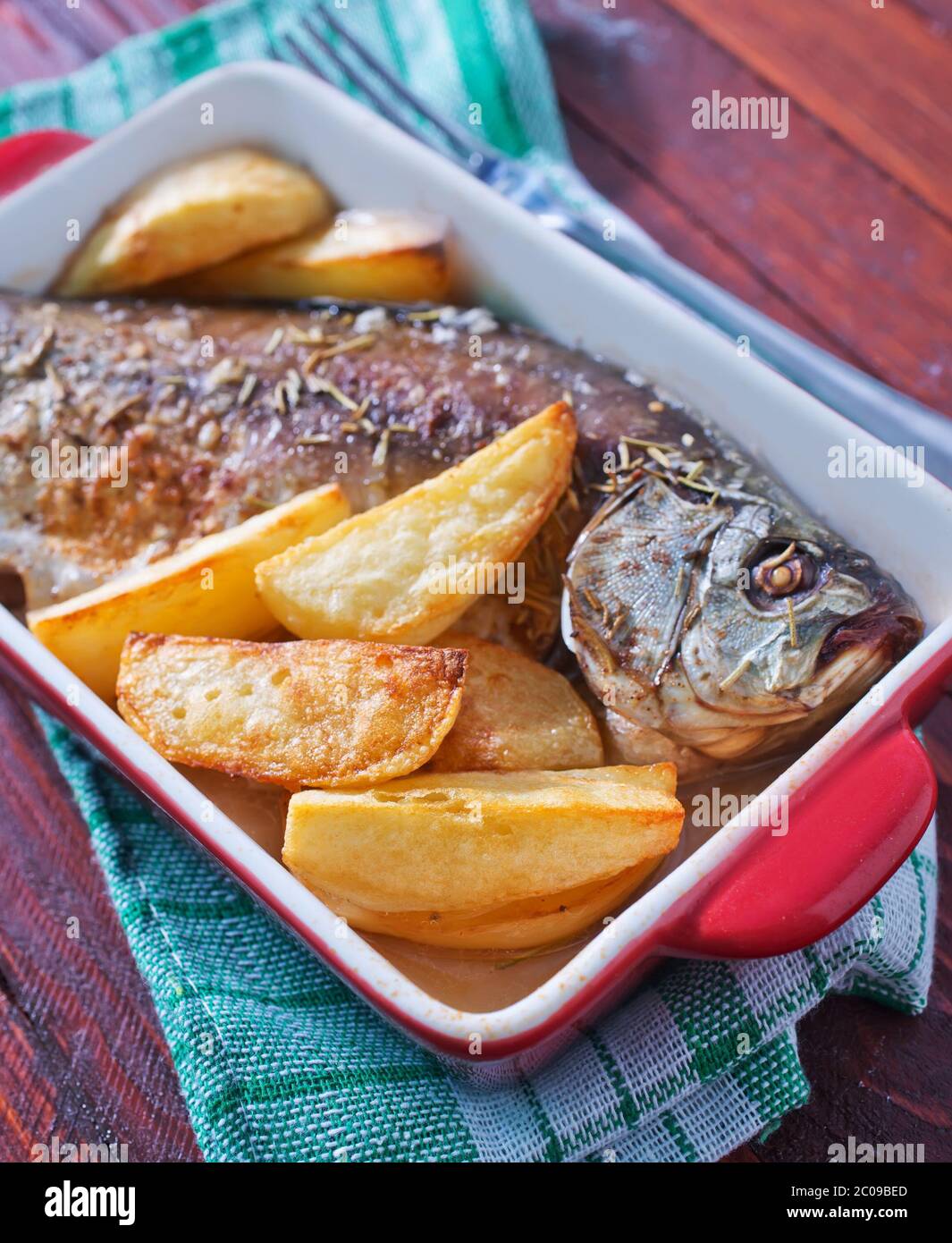baked fish and potato Stock Photo - Alamy