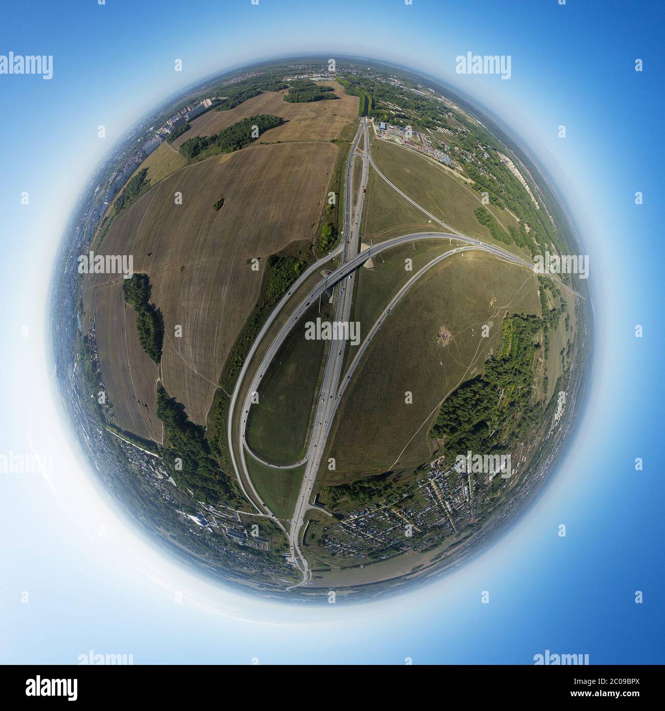 Aerial city view with crossroads, roads, houses, buildings, parks ...