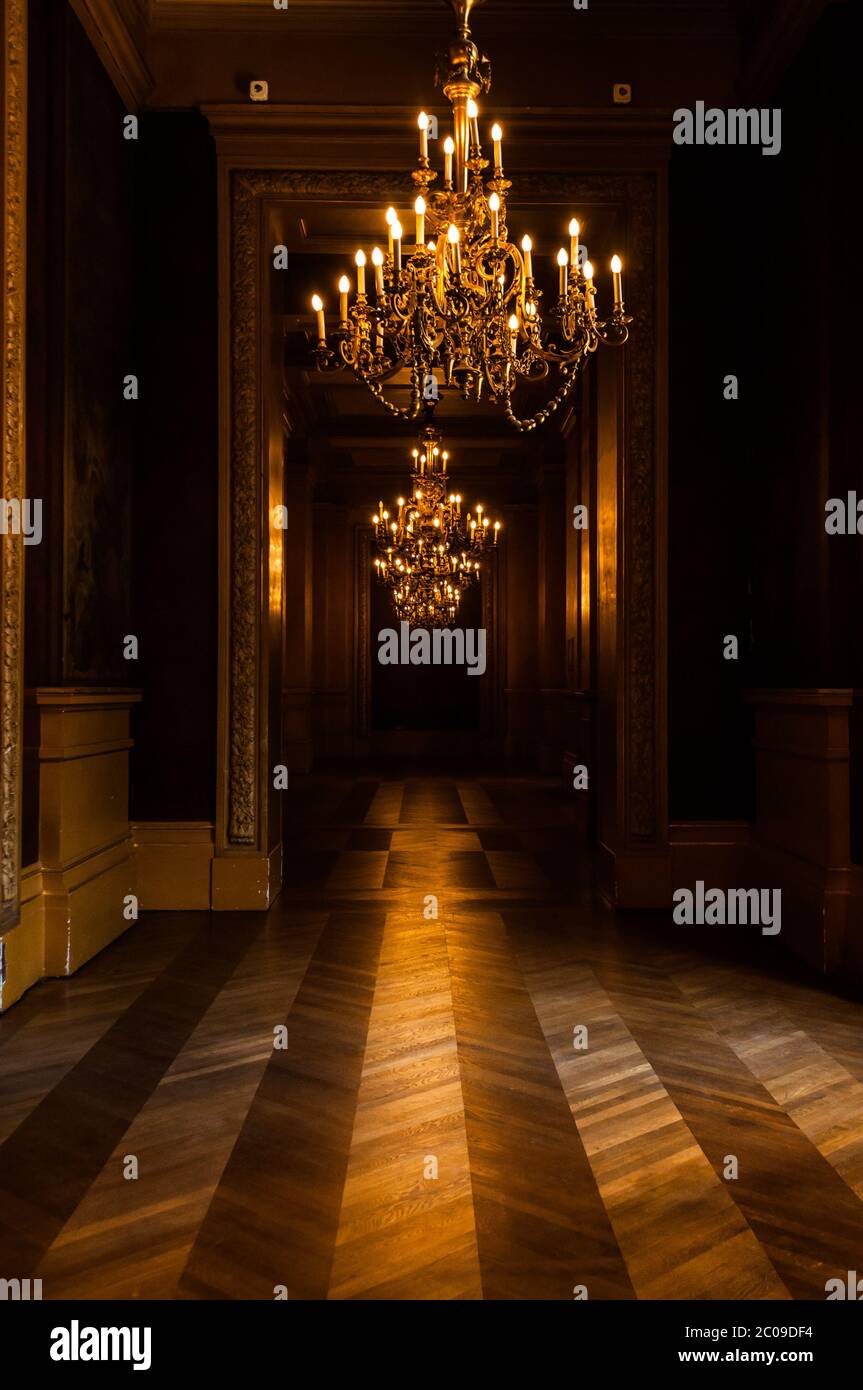 Big corridor with golden ceiling lights and wooden floor Stock Photo ...