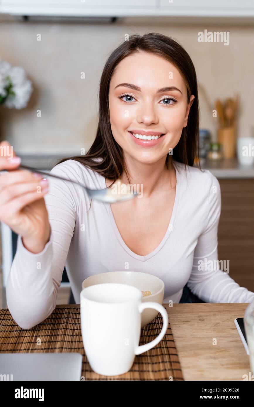 Girl holding spoon hi-res stock photography and images - Alamy