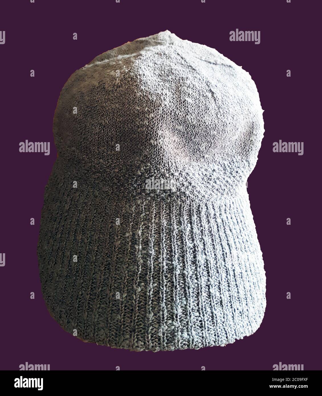 Central perspective image of a gray knitted wool cap isolated on dark ...