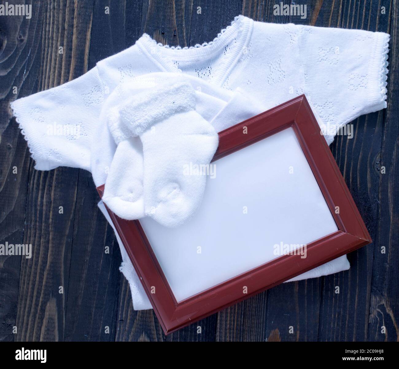 baby clothes on a table Stock Photo - Alamy