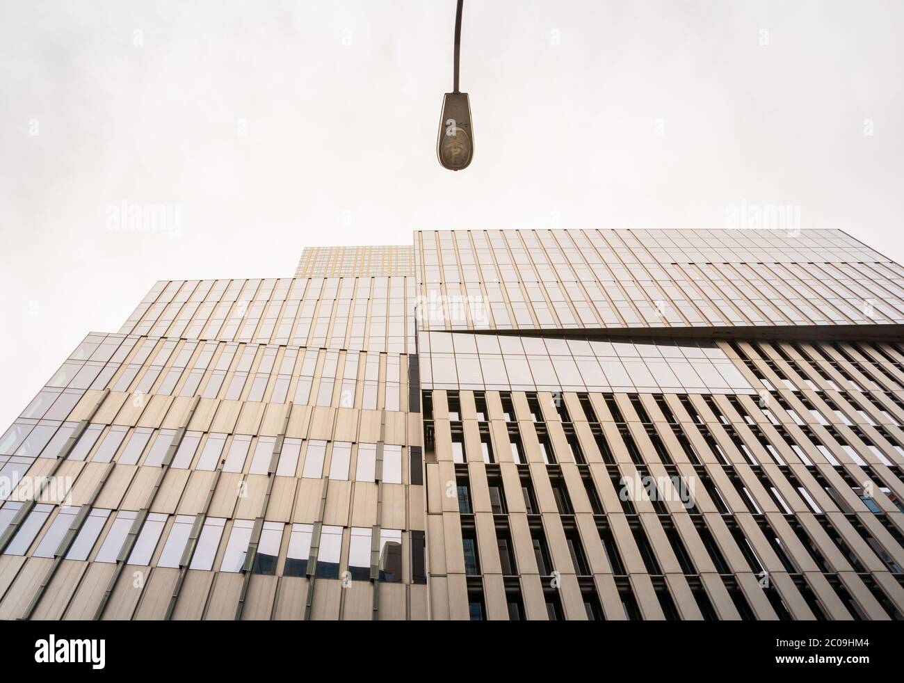 Modern office building and streetlight pillar Stock Photo - Alamy