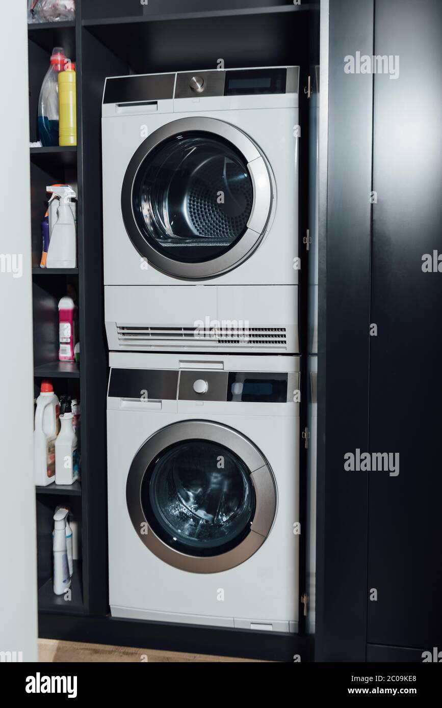 modern and white washing machines at home Stock Photo - Alamy