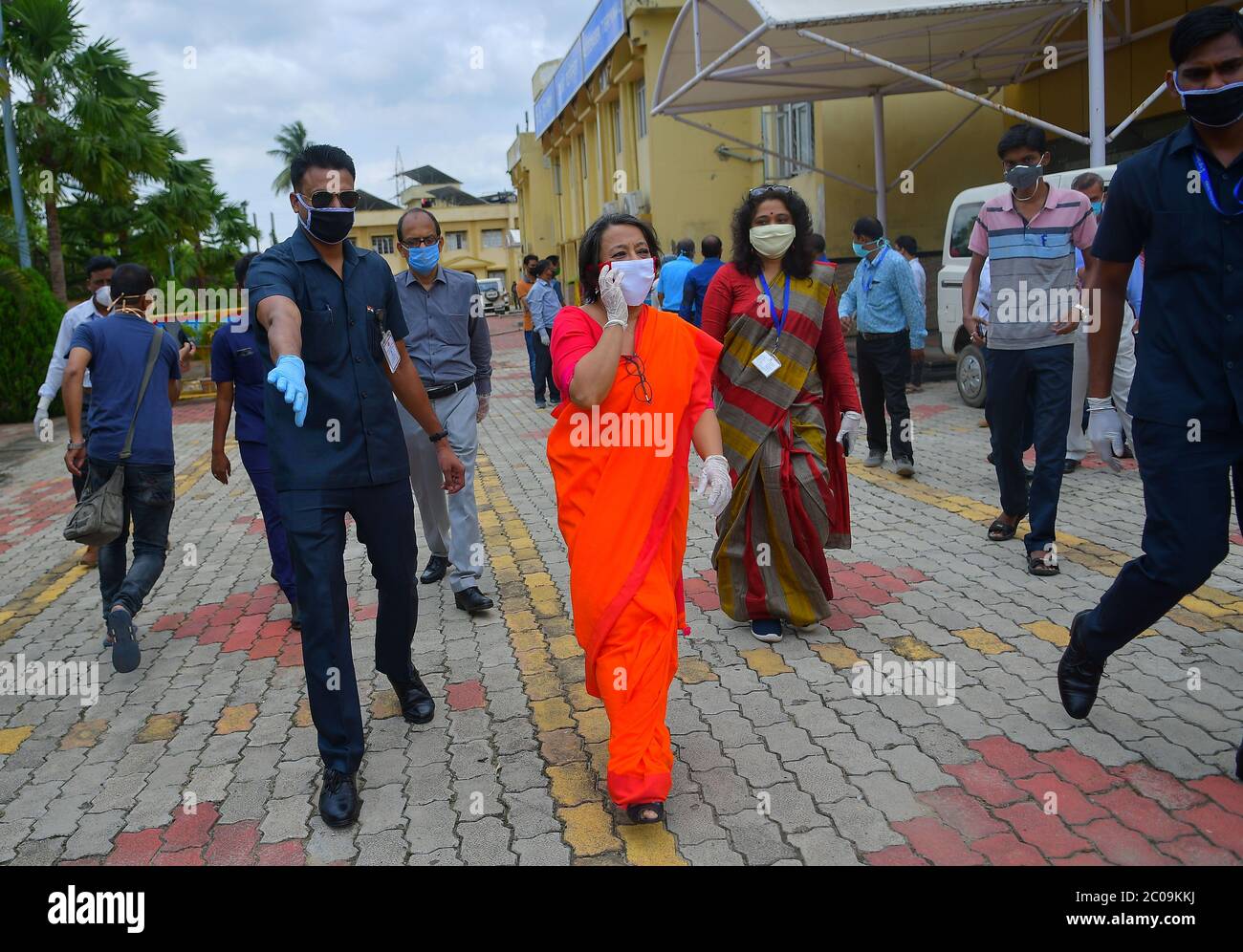 People are waiting in a line to enter Tripura, India through the Akhura ...