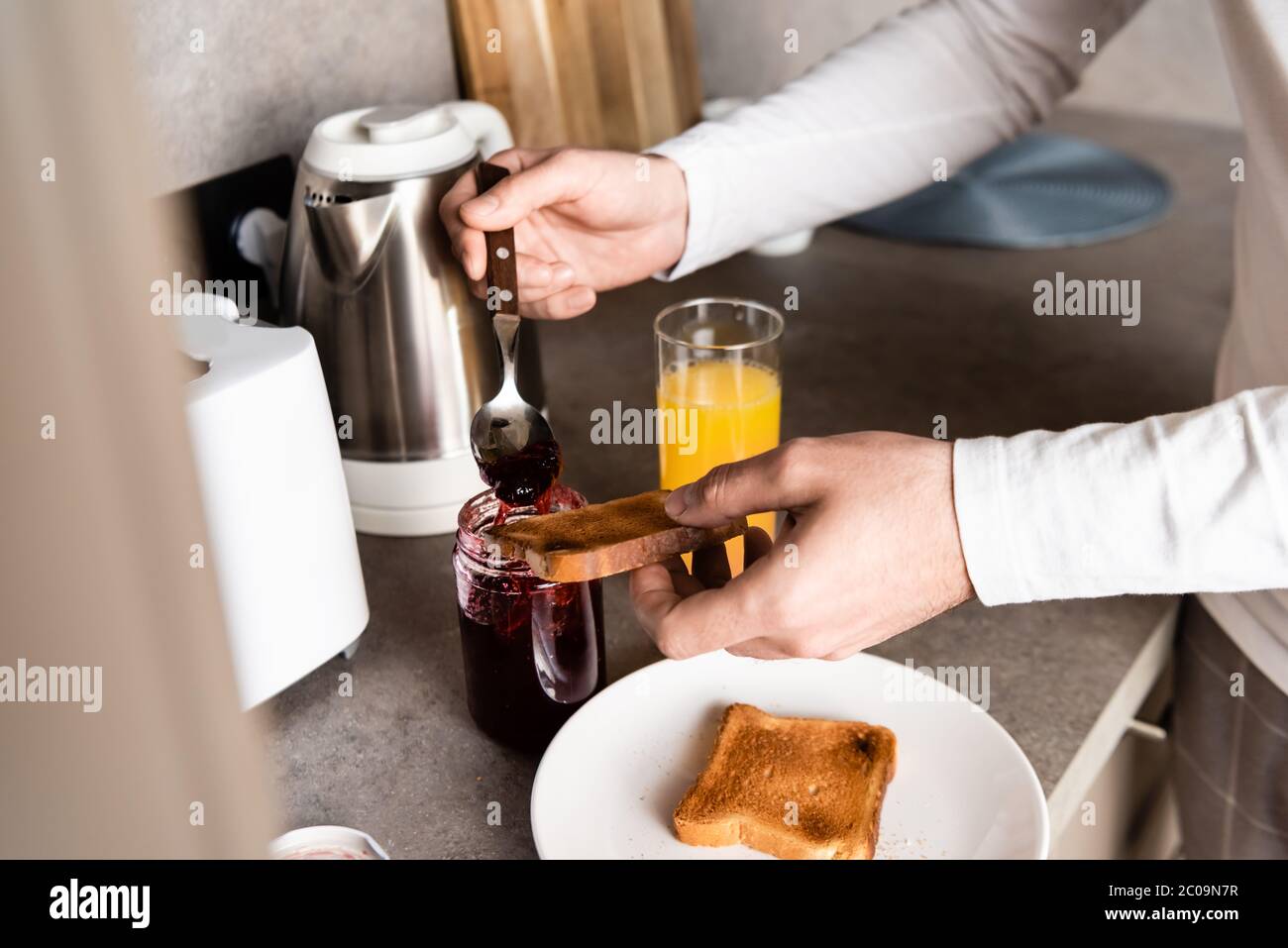Person cutting toast breakfast hi-res stock photography and images - Alamy
