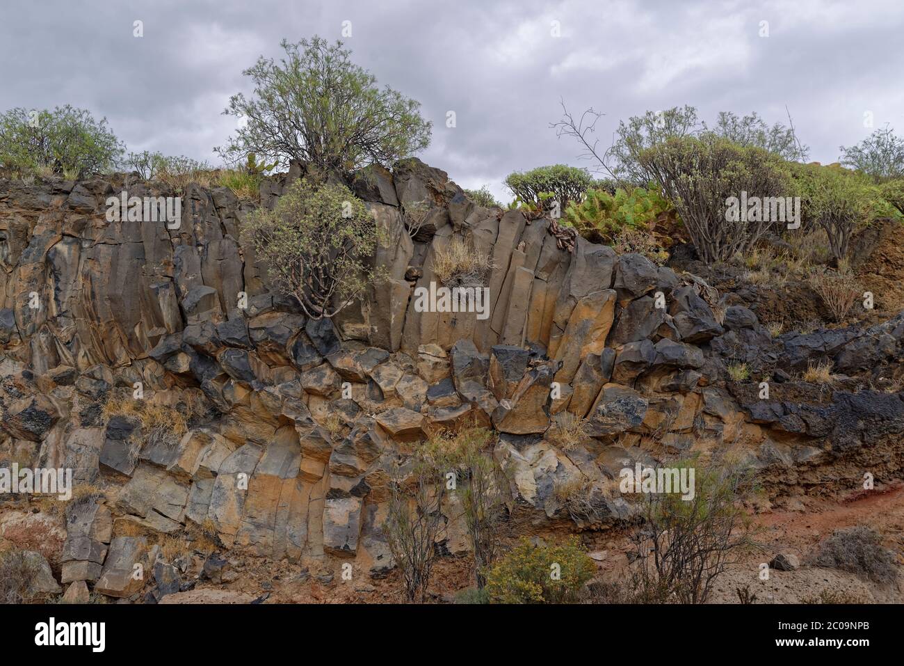 Pillow Lava or Columnar Basalt Rock forming the sides of a small Valley ...