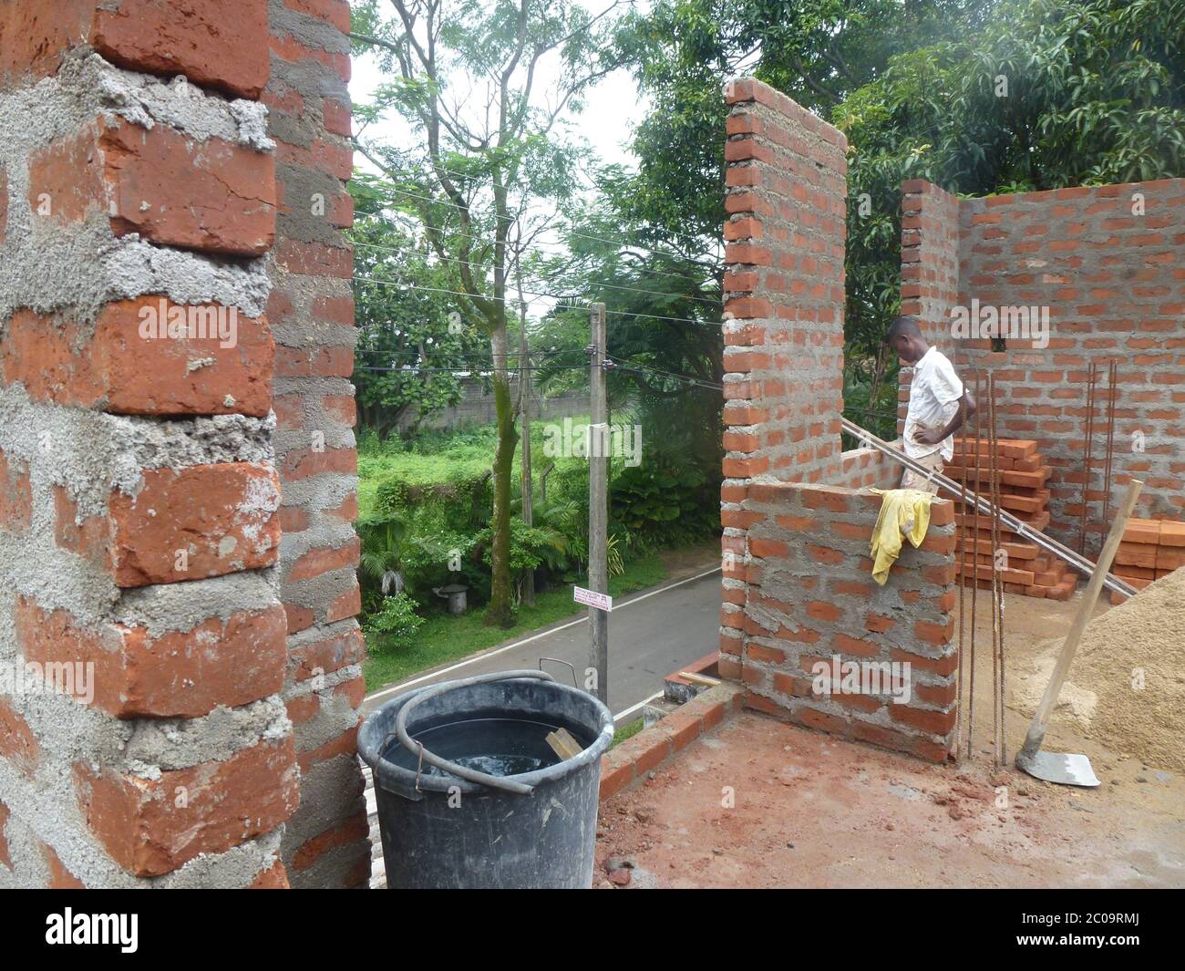 Men working on a construction site, building walls from Bricks. Colombo ...