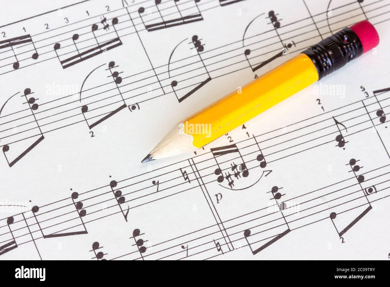 Musical notes with yellow pencil Stock Photo - Alamy