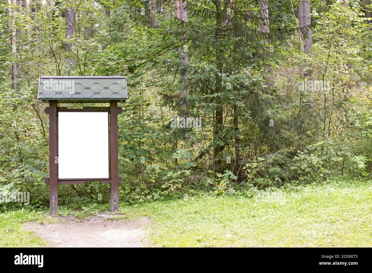 Wooden billboard in the forest Stock Photo - Alamy