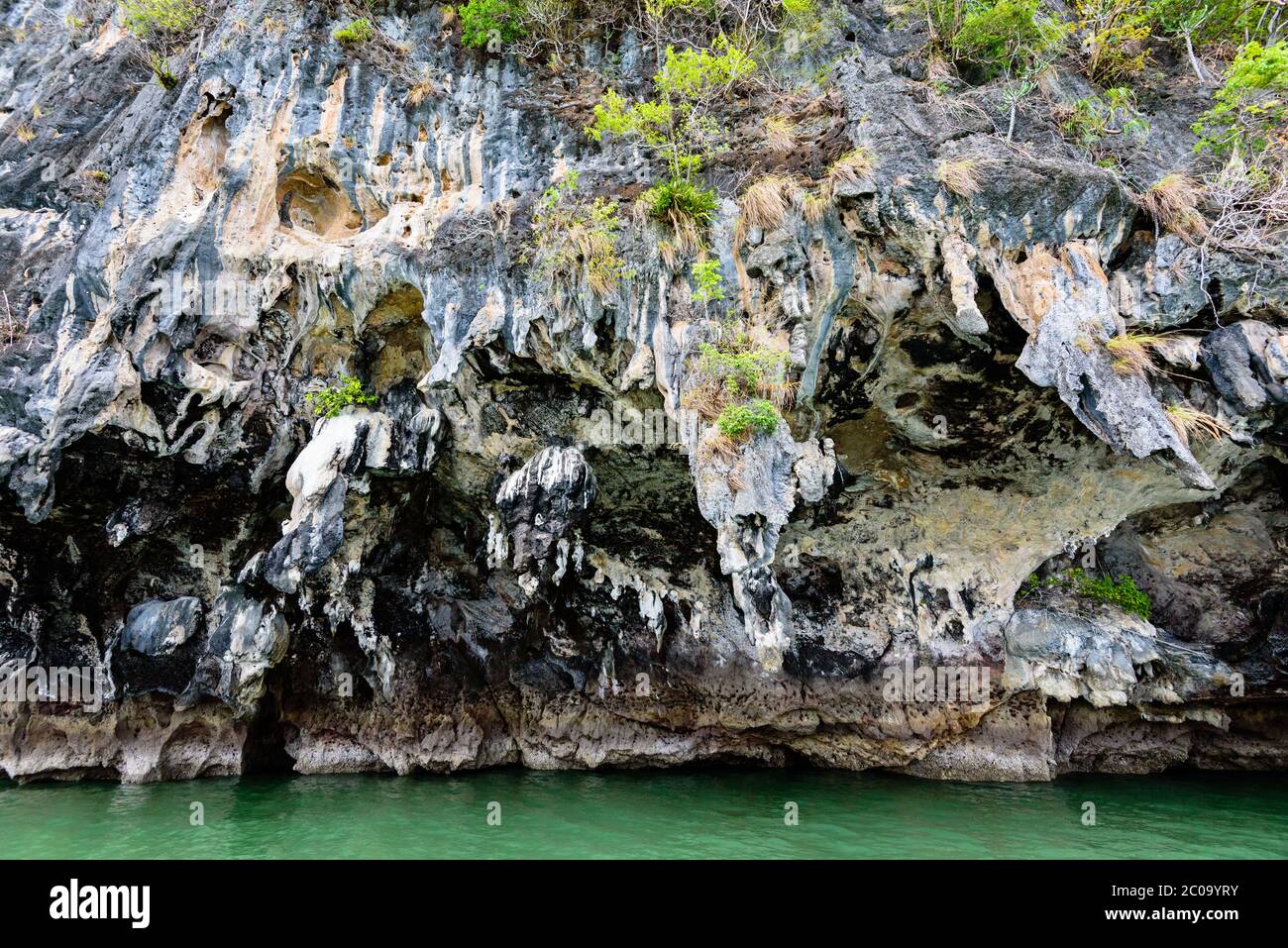Exotic stone caves of the island Stock Photo - Alamy