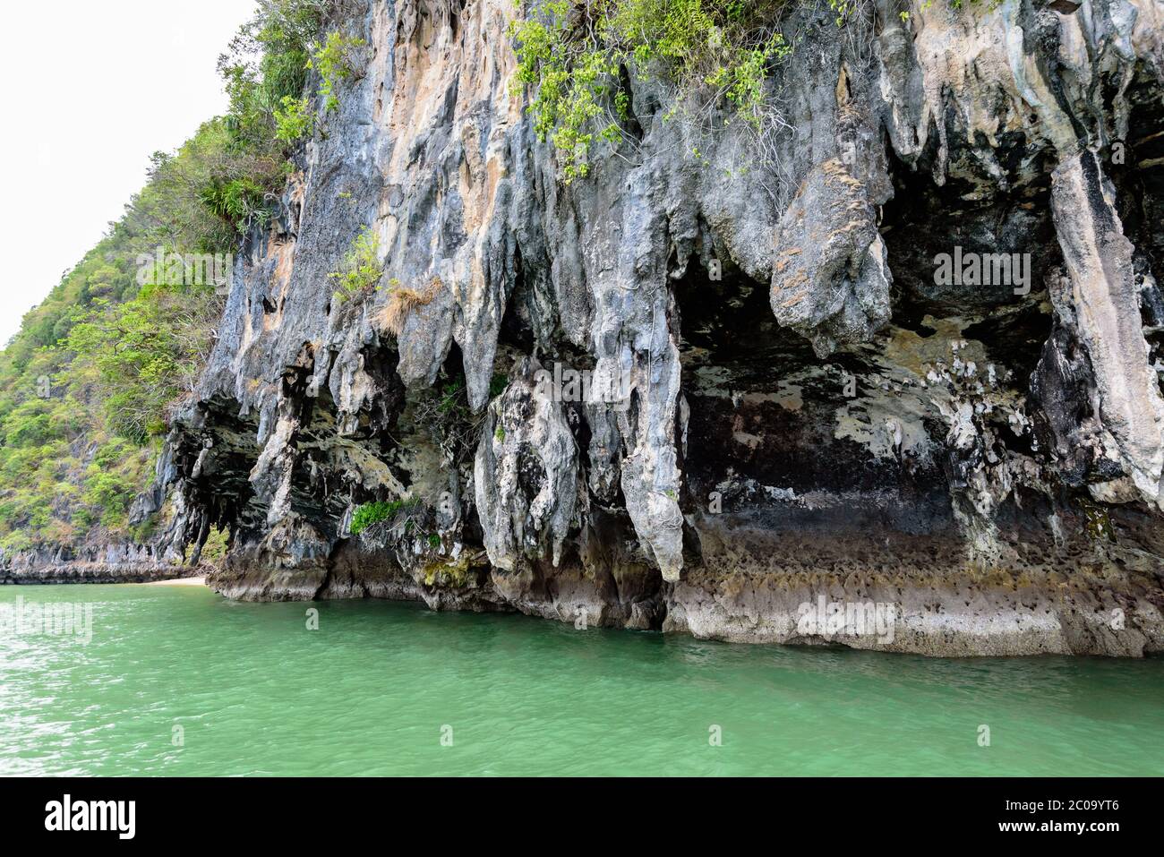 Exotic stone caves of the island Stock Photo - Alamy