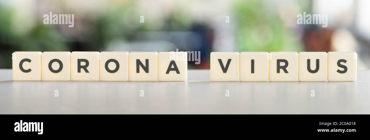 horizontal image of corona virus lettering on white desk Stock Photo ...