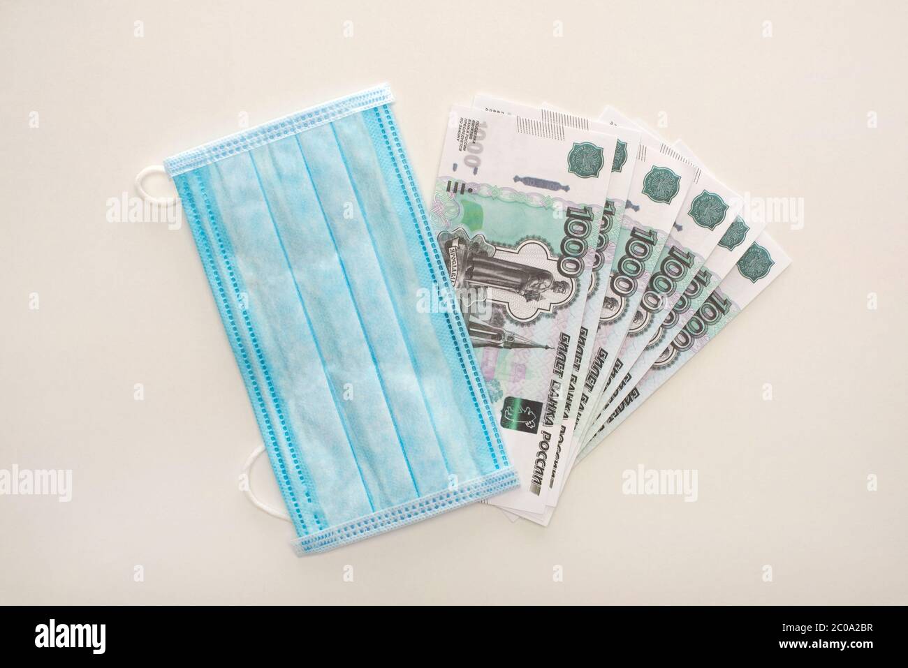 top view of medical mask, Russian rubles on white background Stock ...