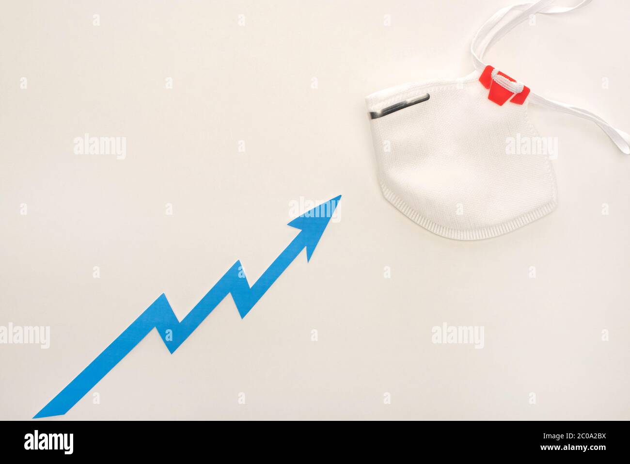 top view of blue arrow and safety mask on white background Stock Photo ...