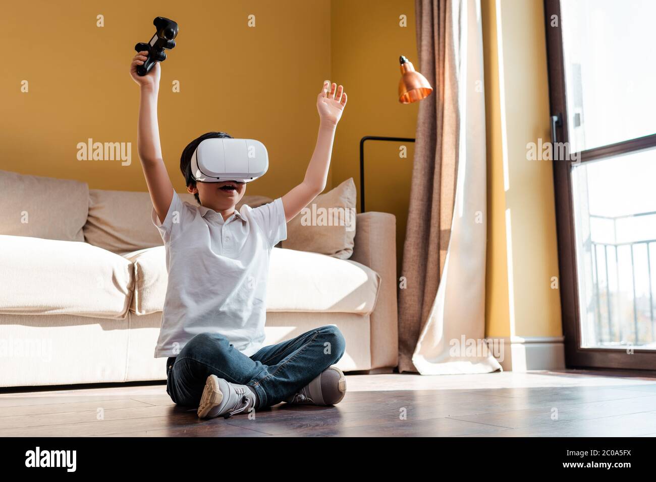KYIV, UKRAINE - APRIL 22, 2020: excited boy playing video game with ...