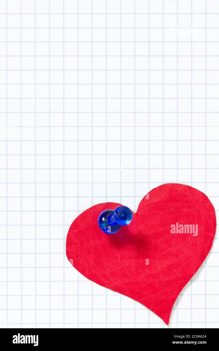 Paper heart pinned to the squared paper sheet Stock Photo - Alamy
