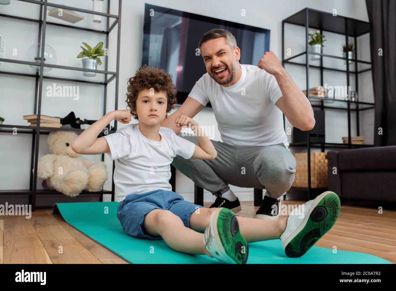 Father Son Showing Muscles High Resolution Stock Photography and Images ...