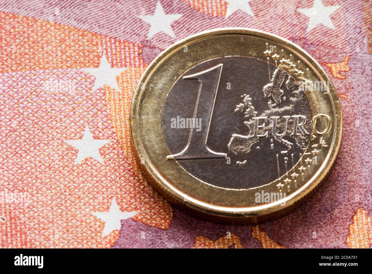 Euro coin on ten Euros banknote Stock Photo - Alamy