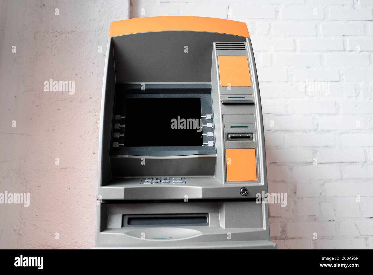 Automated teller machine with blank screen near white brick wall Stock Photo - Alamy