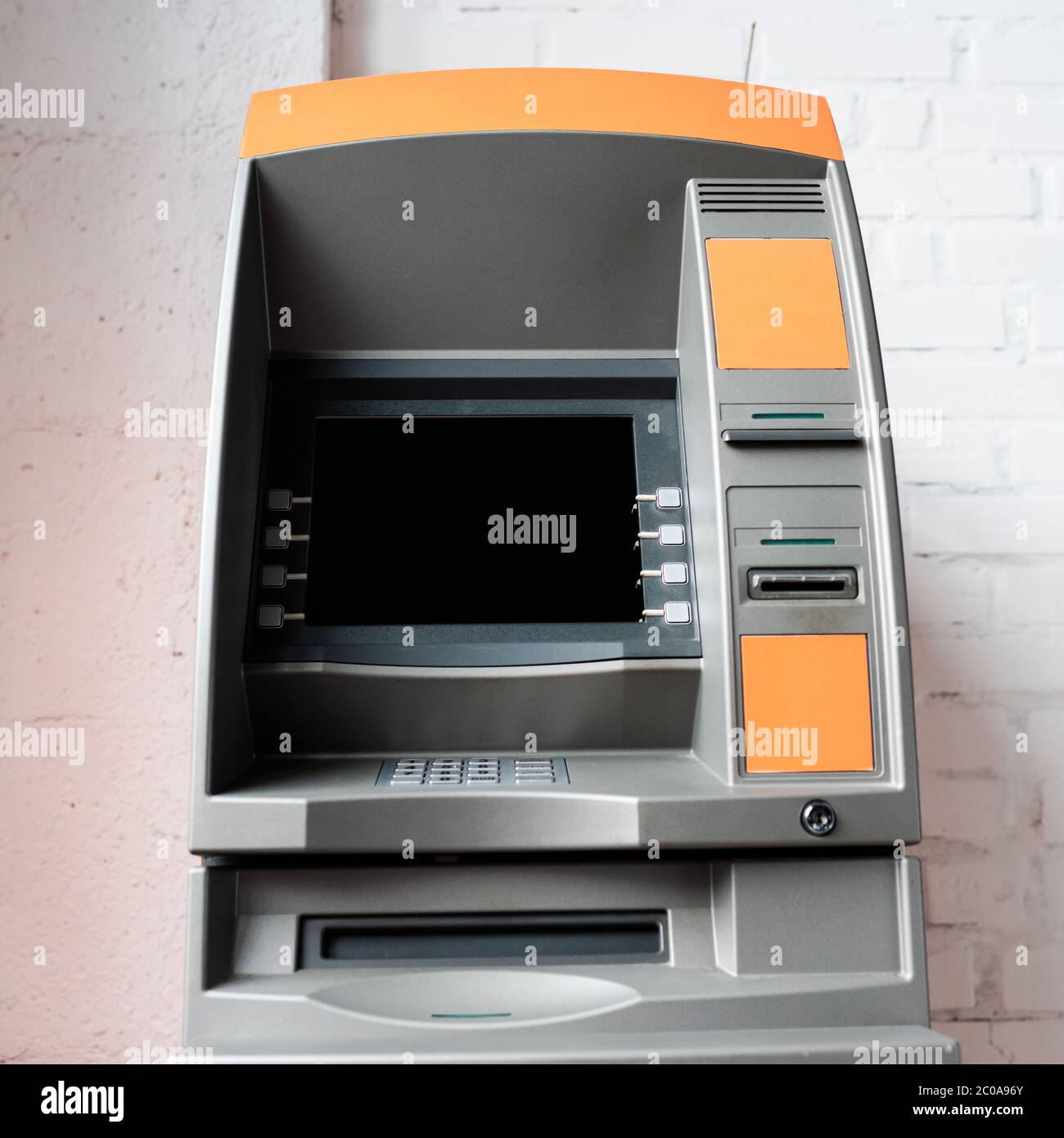 Atm with blank screen near white brick wall Stock Photo - Alamy