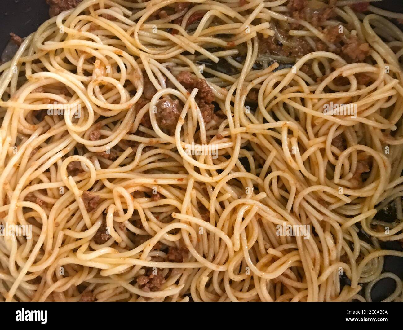 Plate full of spaghetti with meat sauce Stock Photo - Alamy
