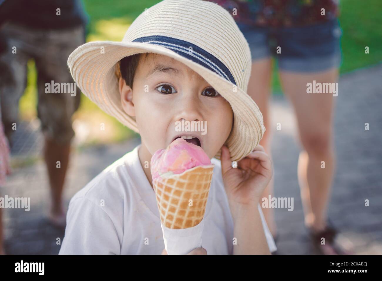Kid eating ice cream cone hi-res stock photography and images - Alamy