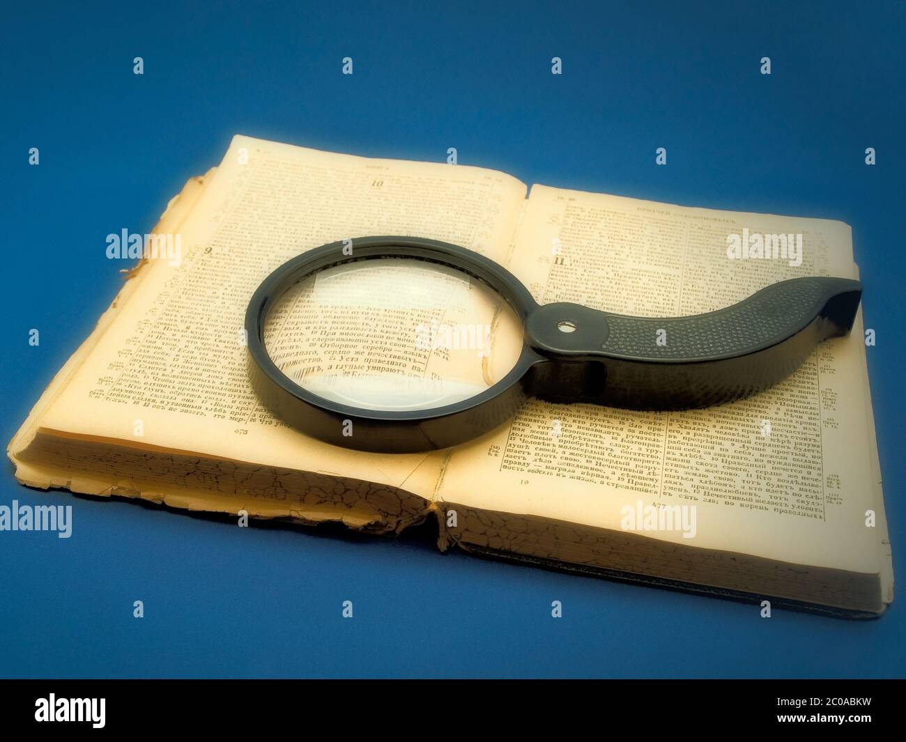 Old book magnifier hi-res stock photography and images - Alamy
