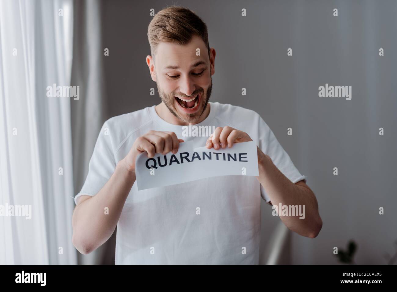 Man ripping paper hi-res stock photography and images - Alamy