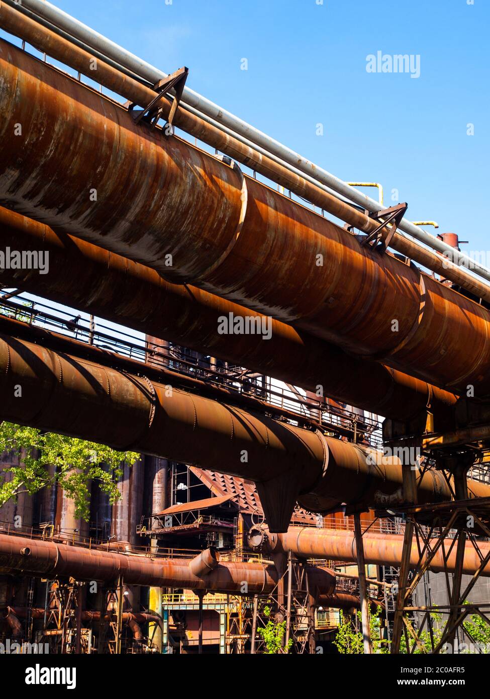Big rusty pipes in an industrial factory Stock Photo - Alamy