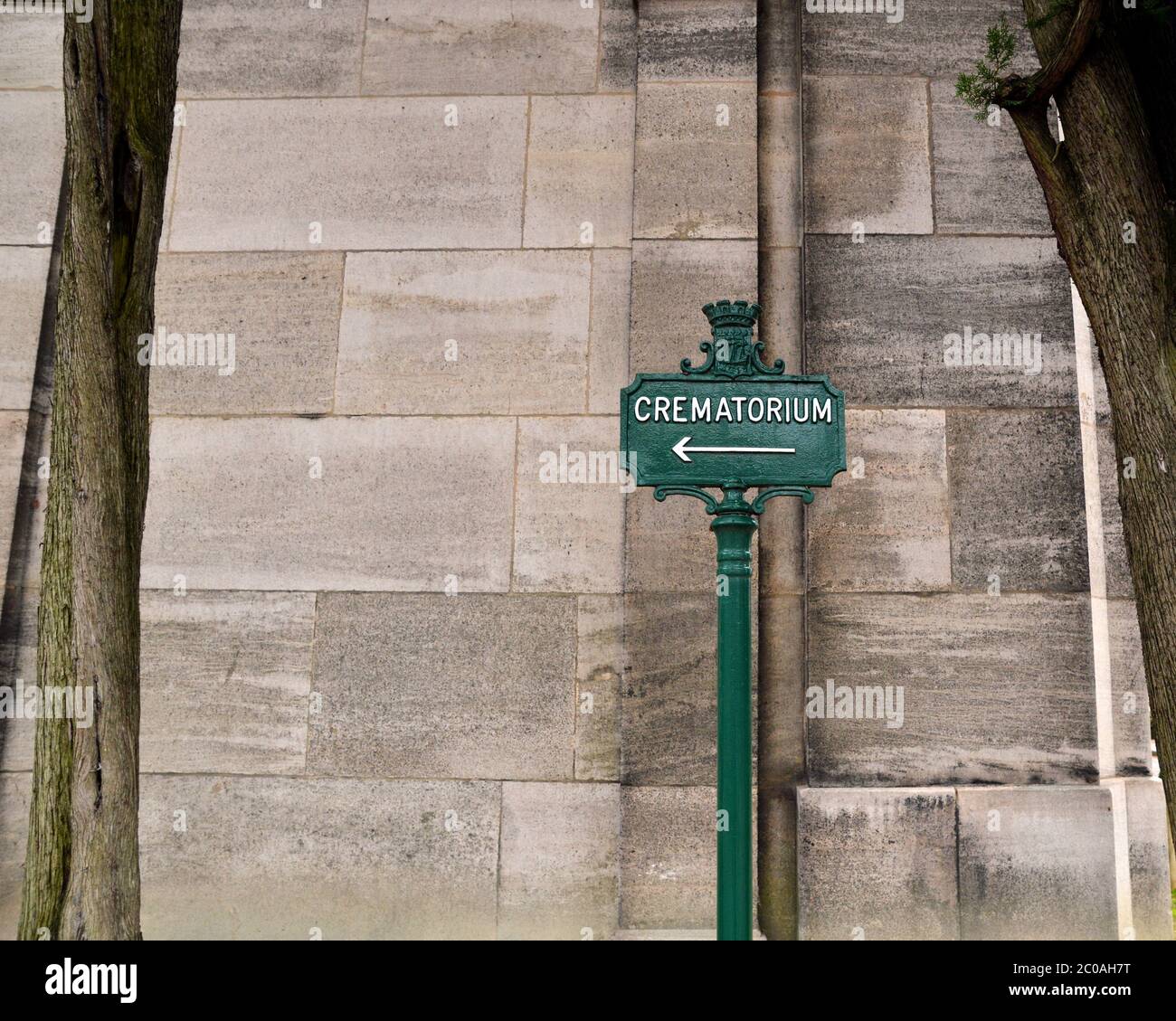 A direction sign in a cemetery, which gives the direction of a ...