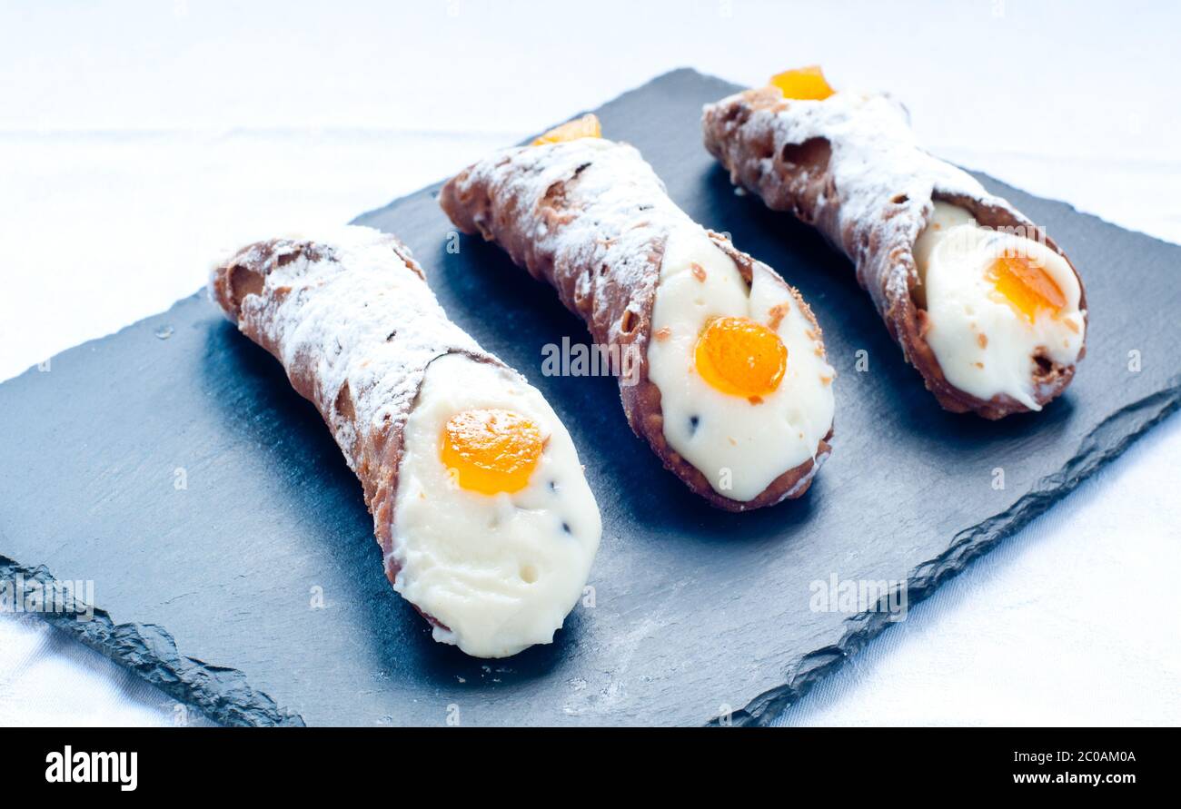 Typical sweet Italian consist cannoli , baba and pastries Stock Photo ...