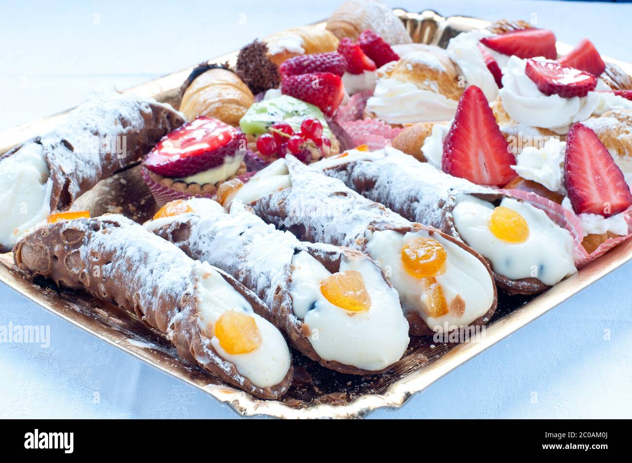 Typical sweet Italian consist cannoli , baba and pastries Stock Photo ...