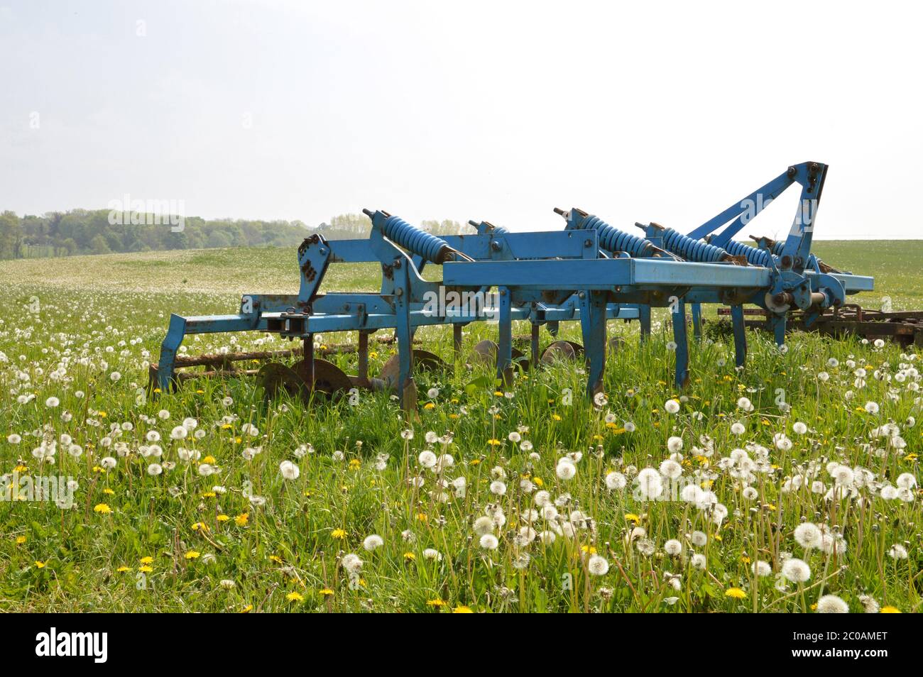 Agricultural plow in a green field in the countryside Stock Photo - Alamy