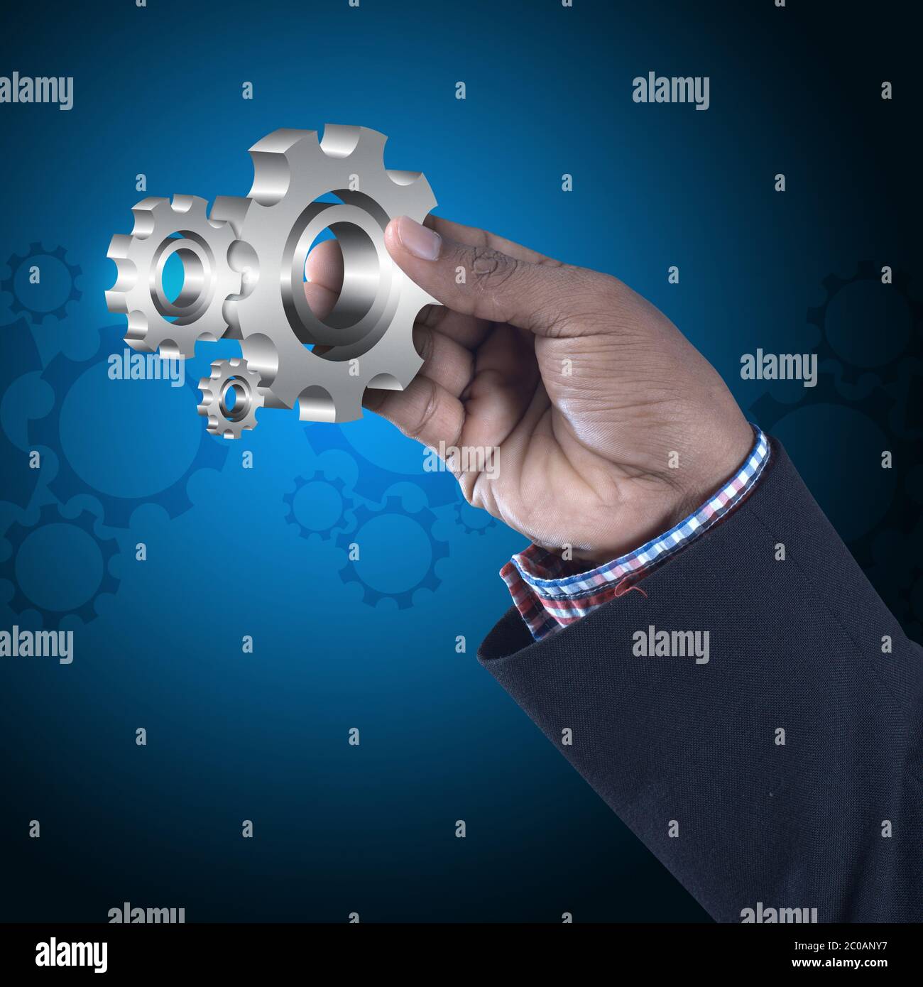 businessman showing gears cogs to success concept Stock Photo - Alamy