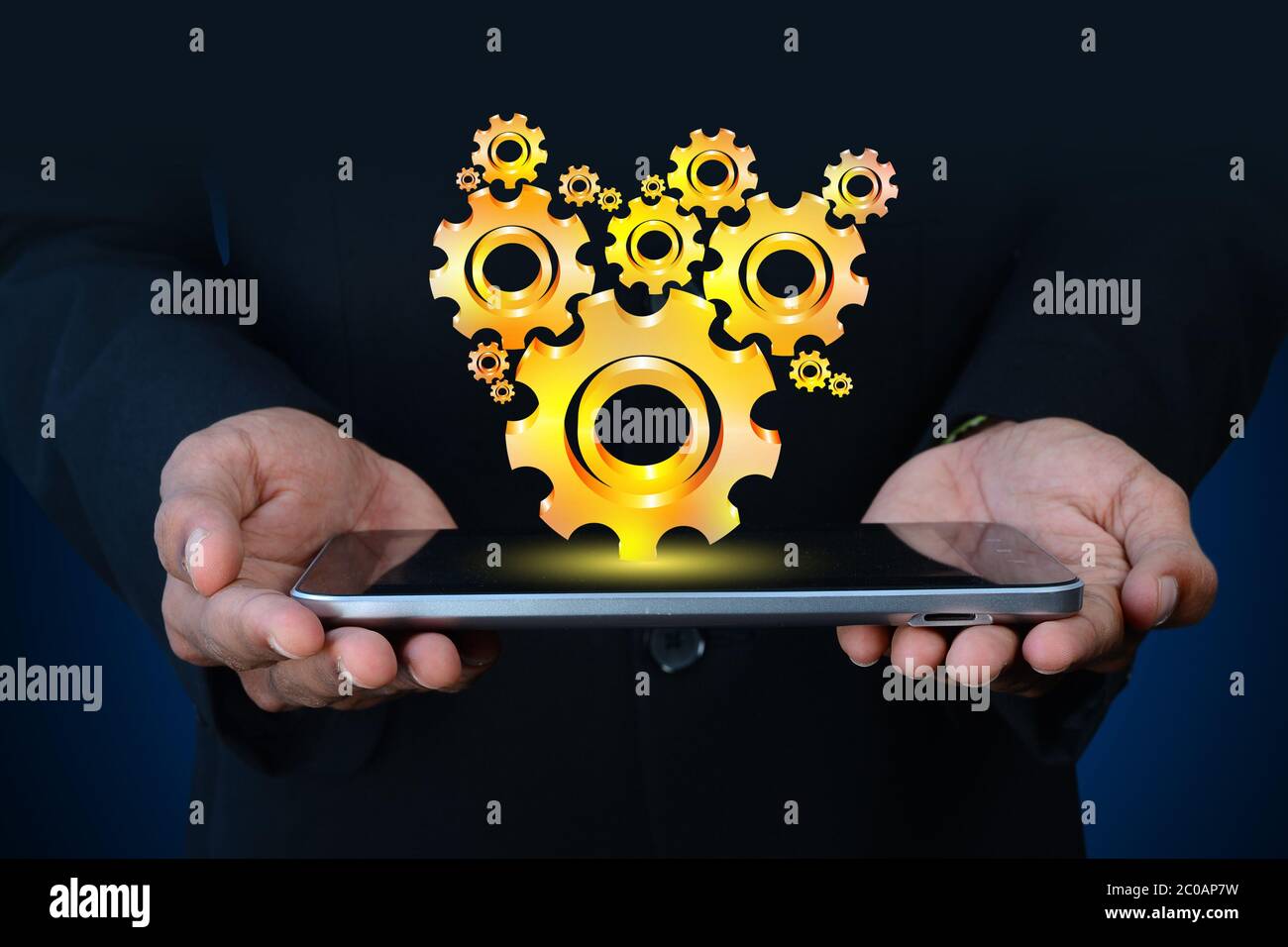businessman showing gears cogs to success concept Stock Photo - Alamy